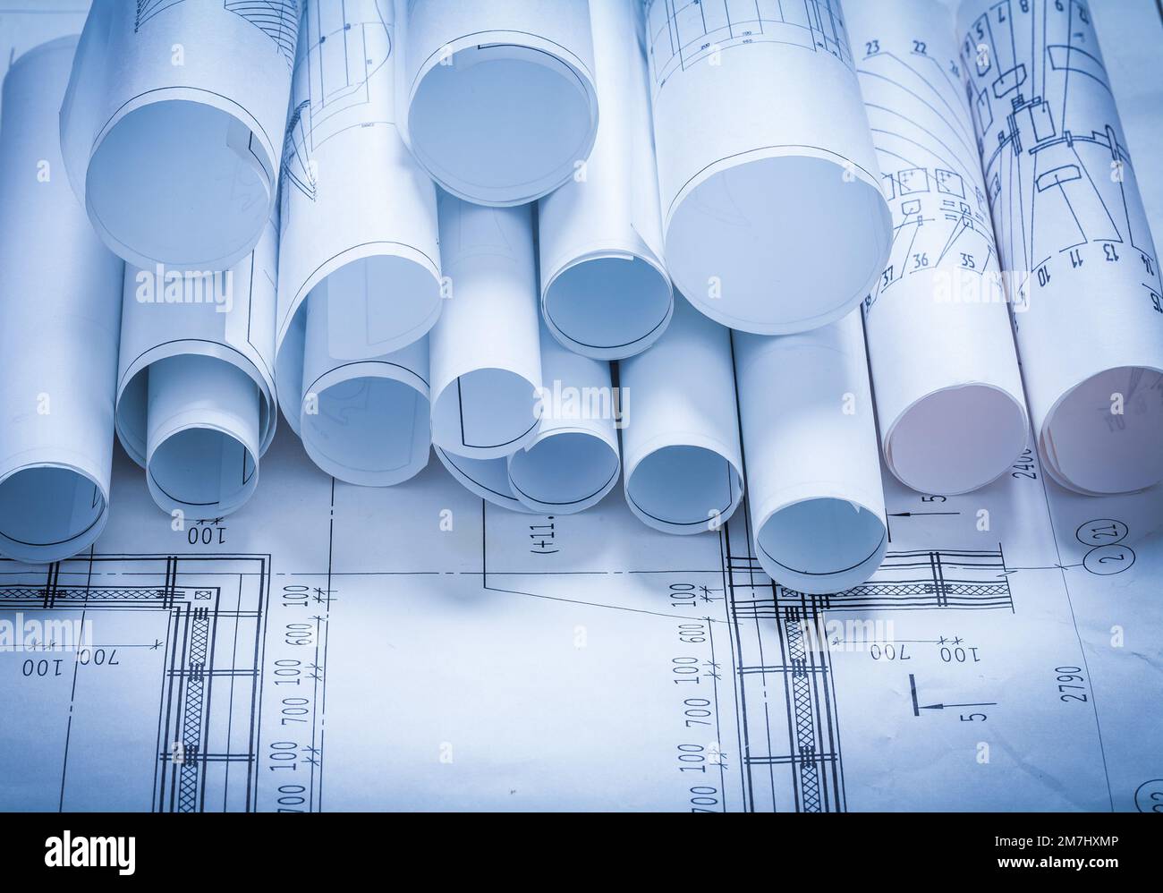 Composition of blueprint rolls construction concept Stock Photo - Alamy