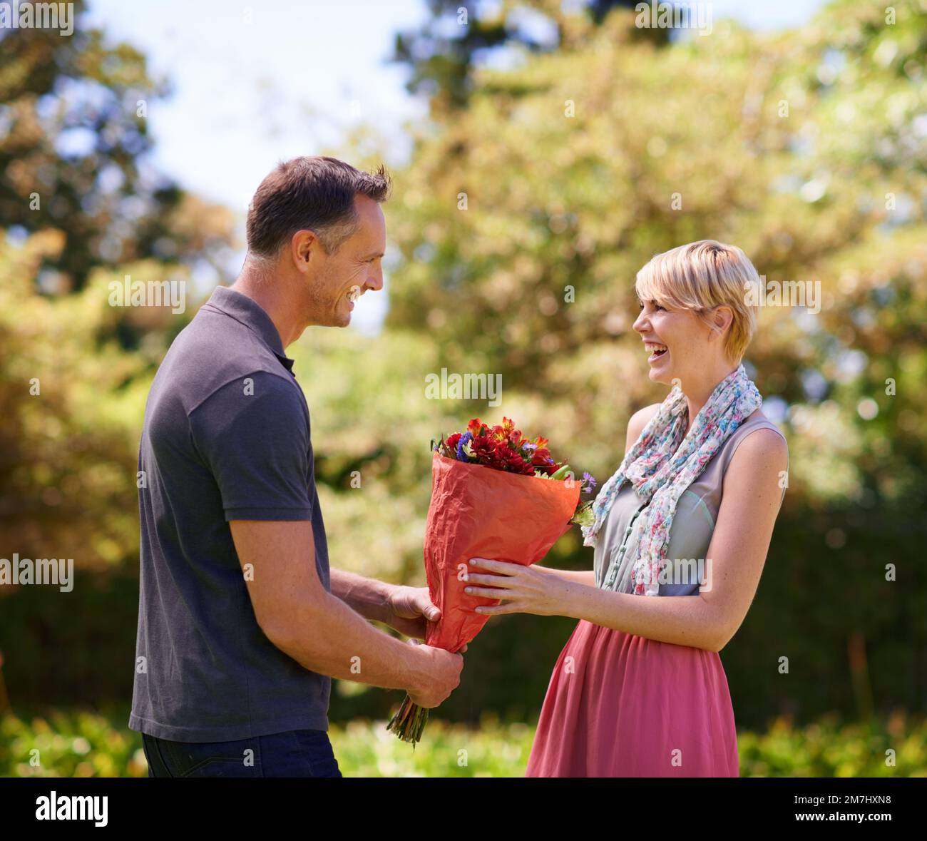 Every woman deserves flowers. a mature woman getting a bouquet of ...