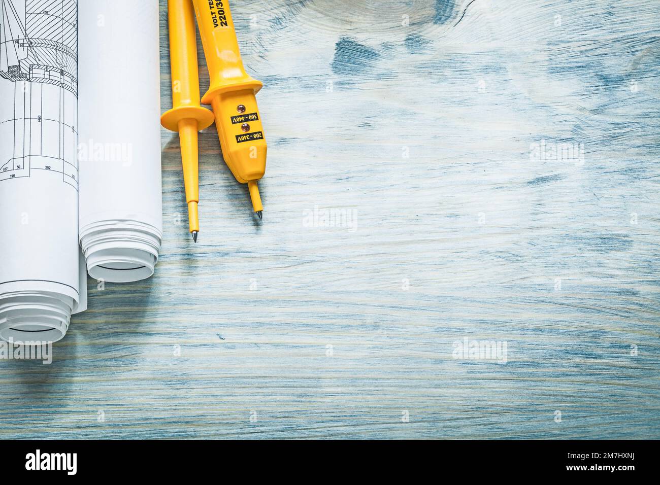 Composition of electric tester construction drawings on wooden board ...