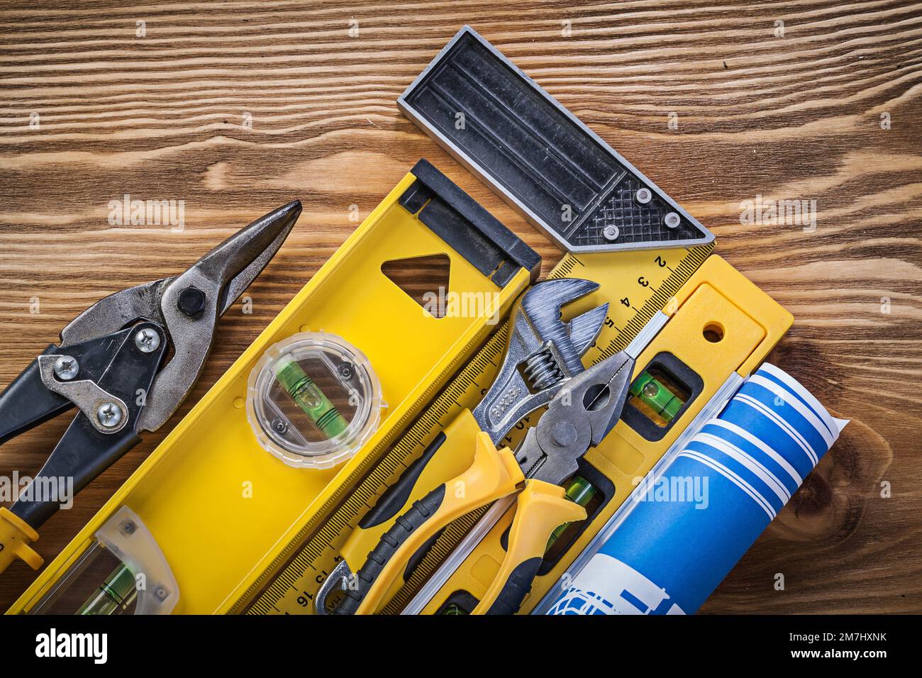 Composition of construction tools on vintage wooden board top view ...