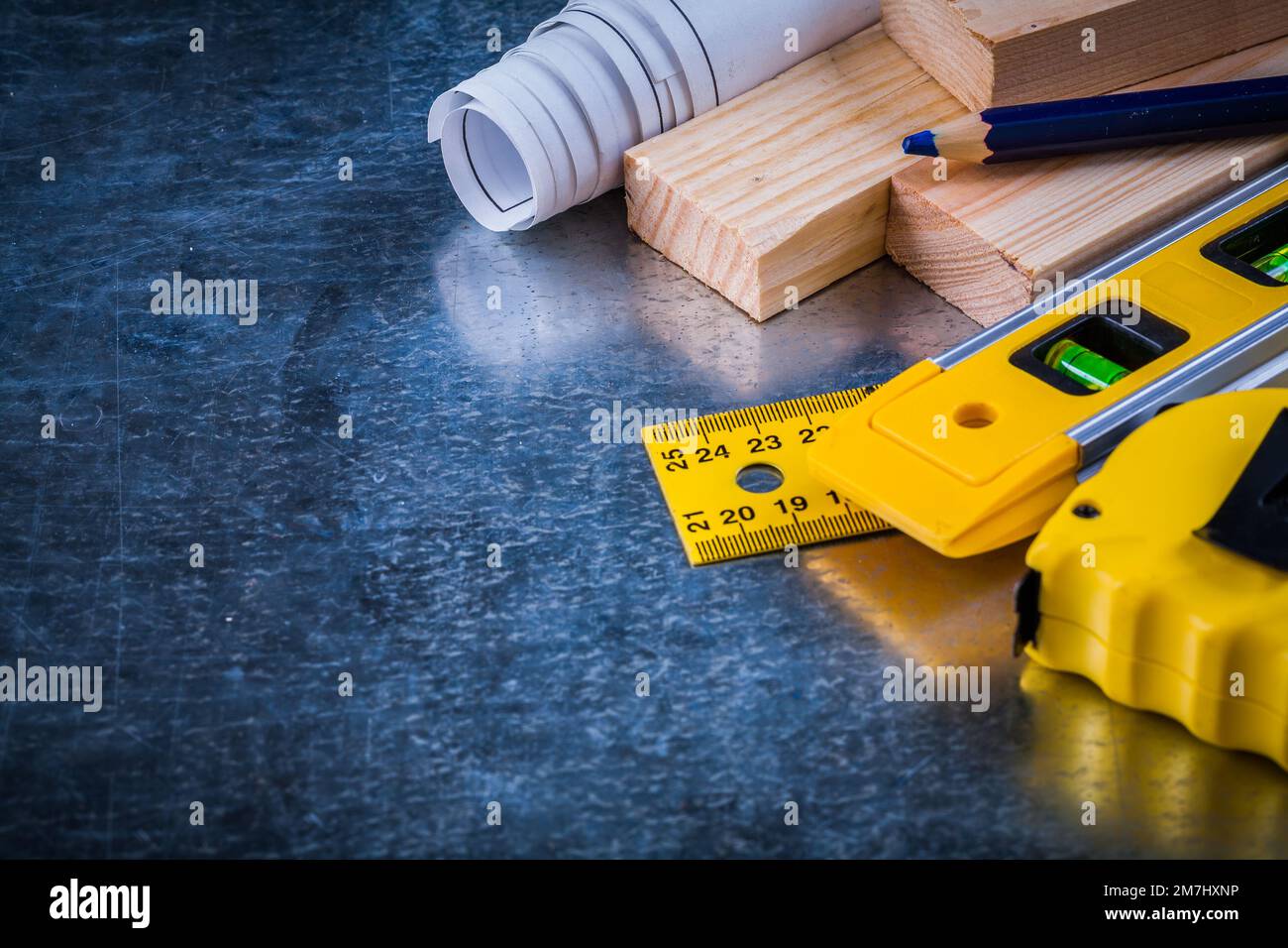 Composition of construction working tools on metallic scratched ...