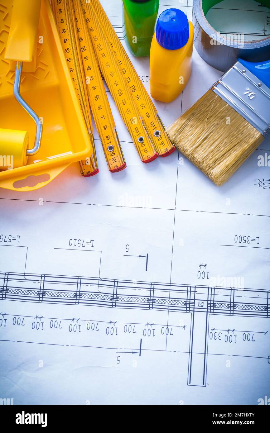 Construction drawing with paint objects household tape and wooden meter ...