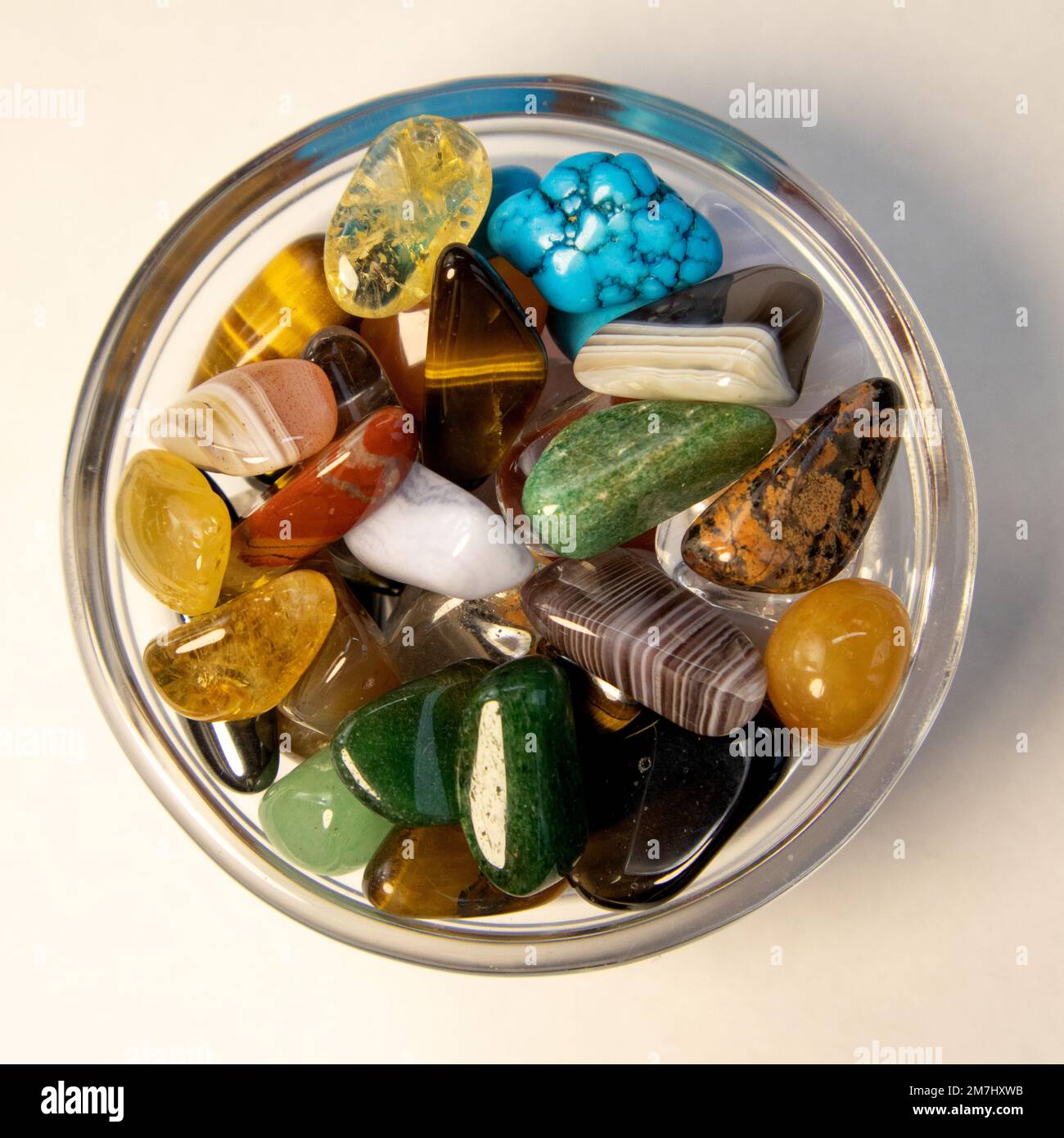 Collection Of Semi-Precious Gemstones on white textured board ...