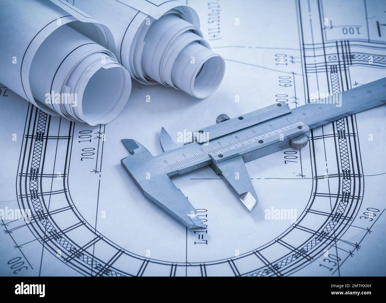 Construction drawings metal caliper on blueprint architecture and ...