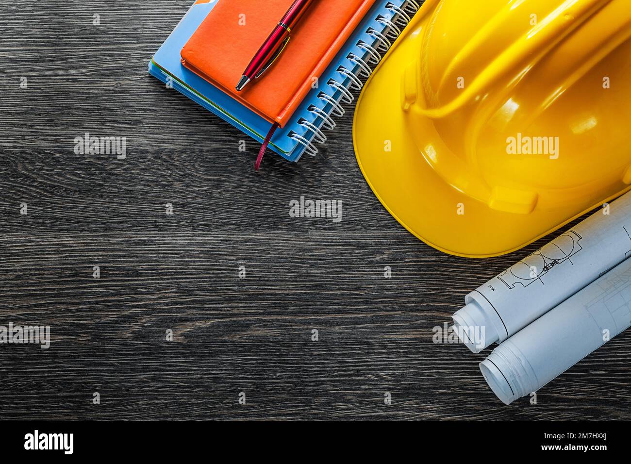 Construction drawings building helmet notepads pen on wood board Stock ...