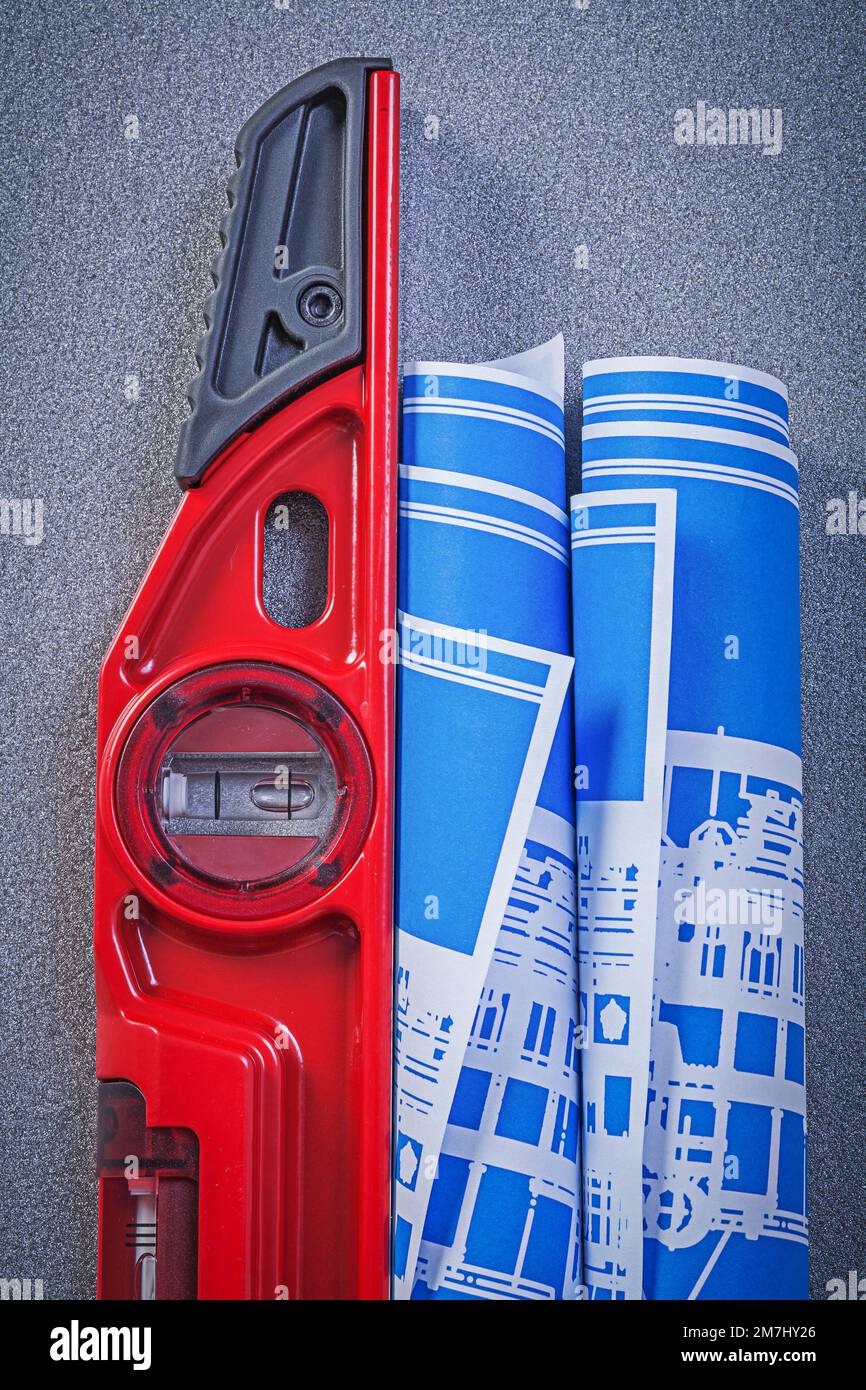 Construction level blue engineering drawings on grey background ...