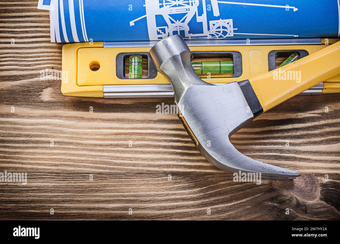 Construction level drawing claw hammer on vintage wooden board Stock ...