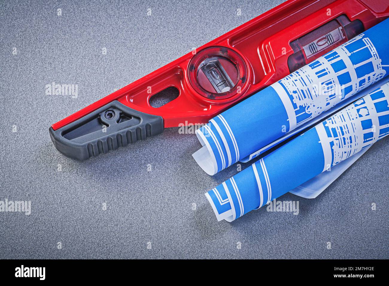 Construction level blue drawings on grey background maintenance concept ...