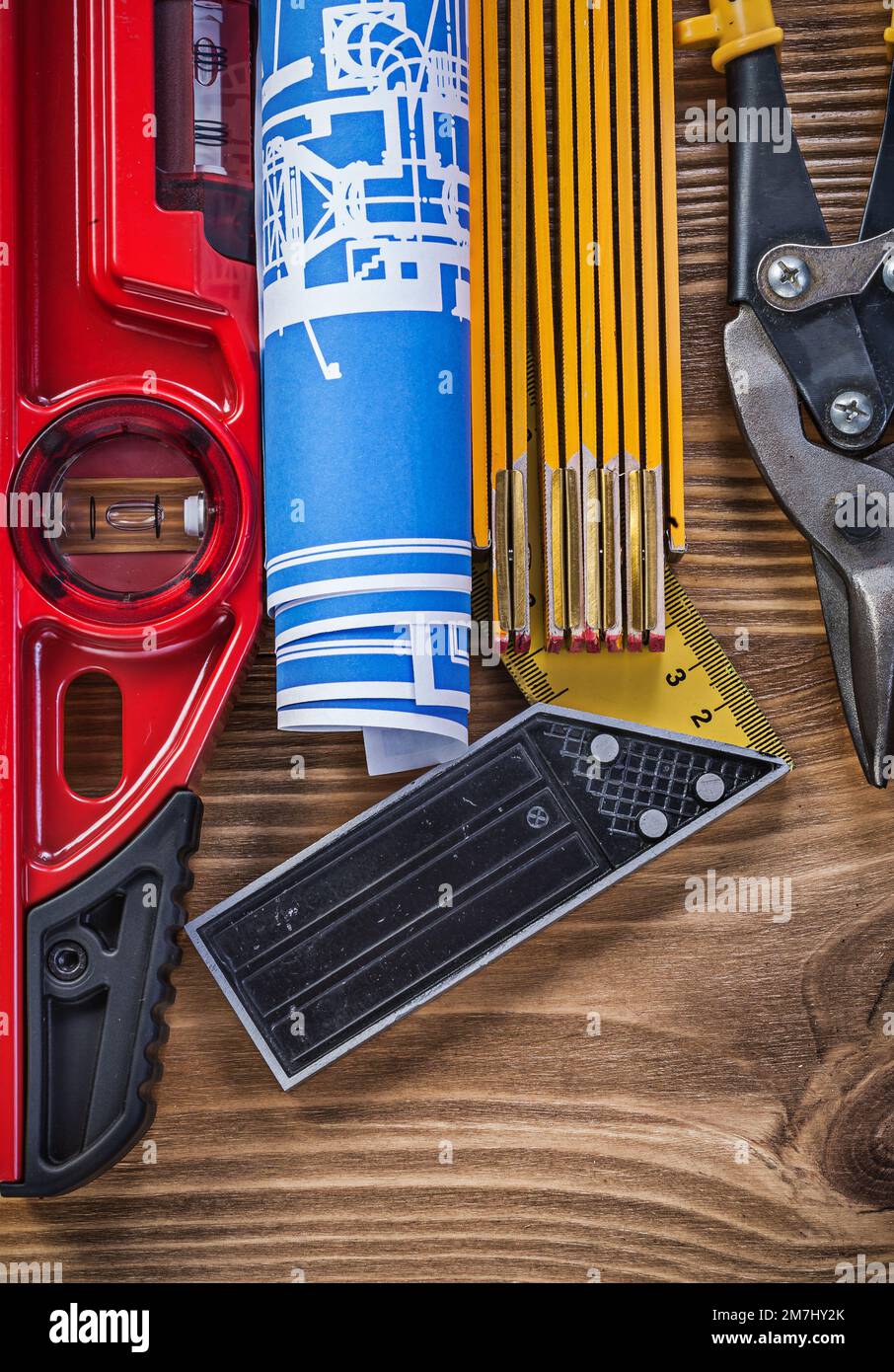 Construction level drawing steel cutter wooden meter try square on wood ...