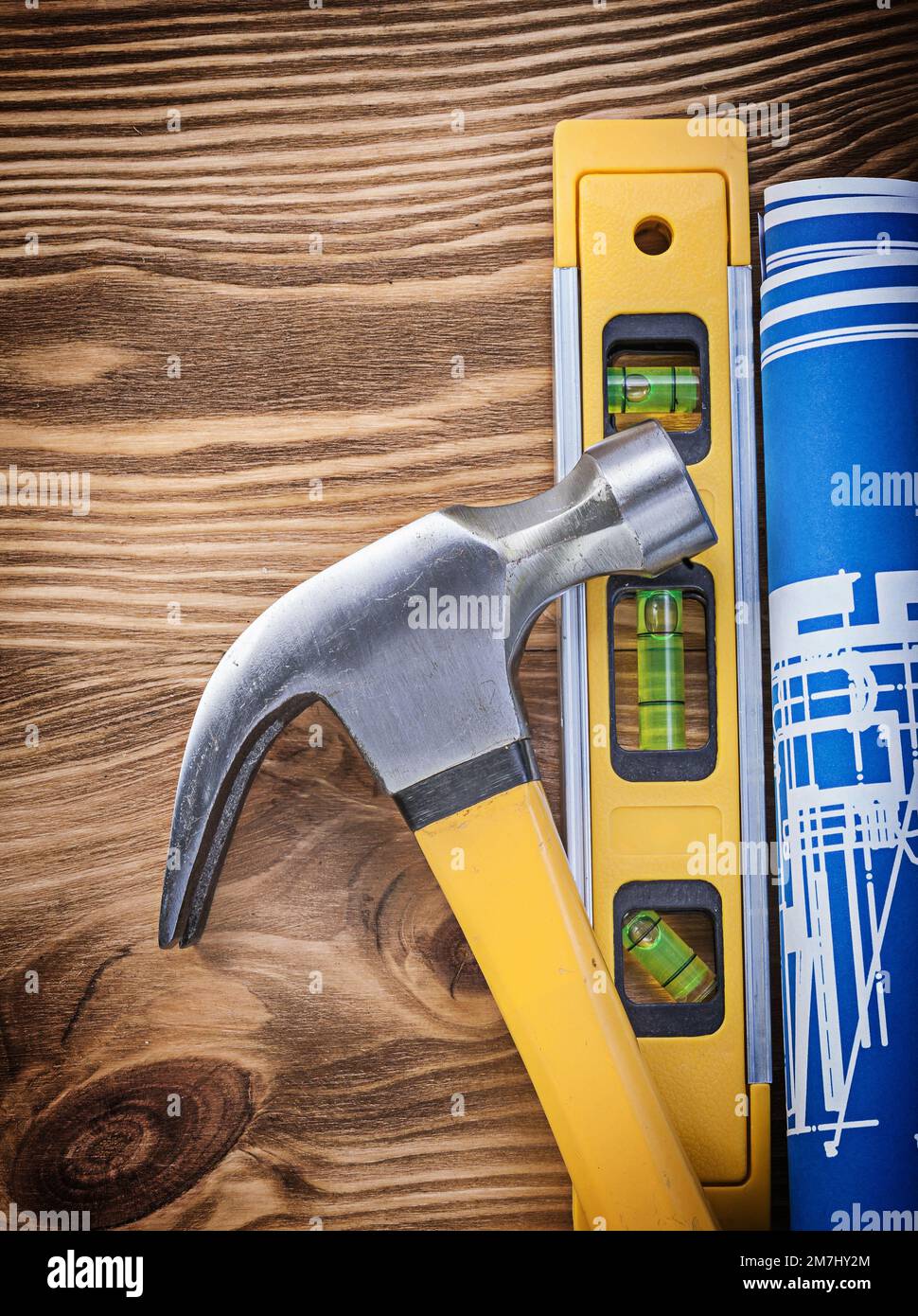 Construction level engineering drawing claw hammer on vintage wooden ...