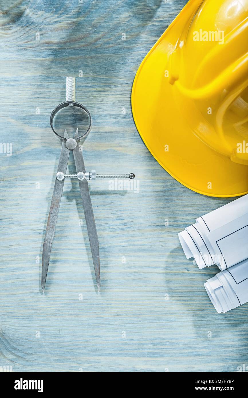 Divider engineering drawings hard hat on wooden board construction ...