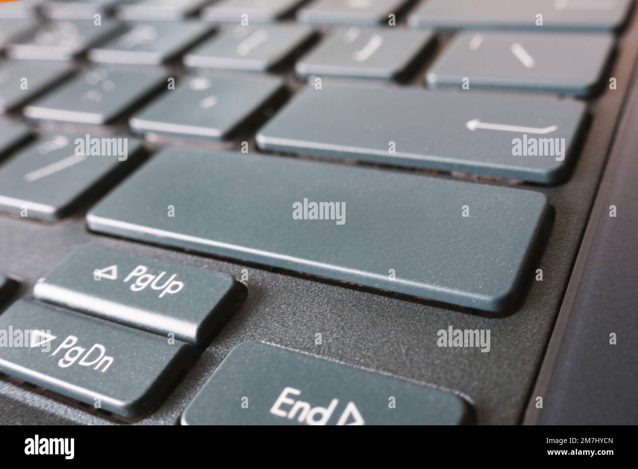 button on the black keyboard of modern ultrabook close up. caption on ...