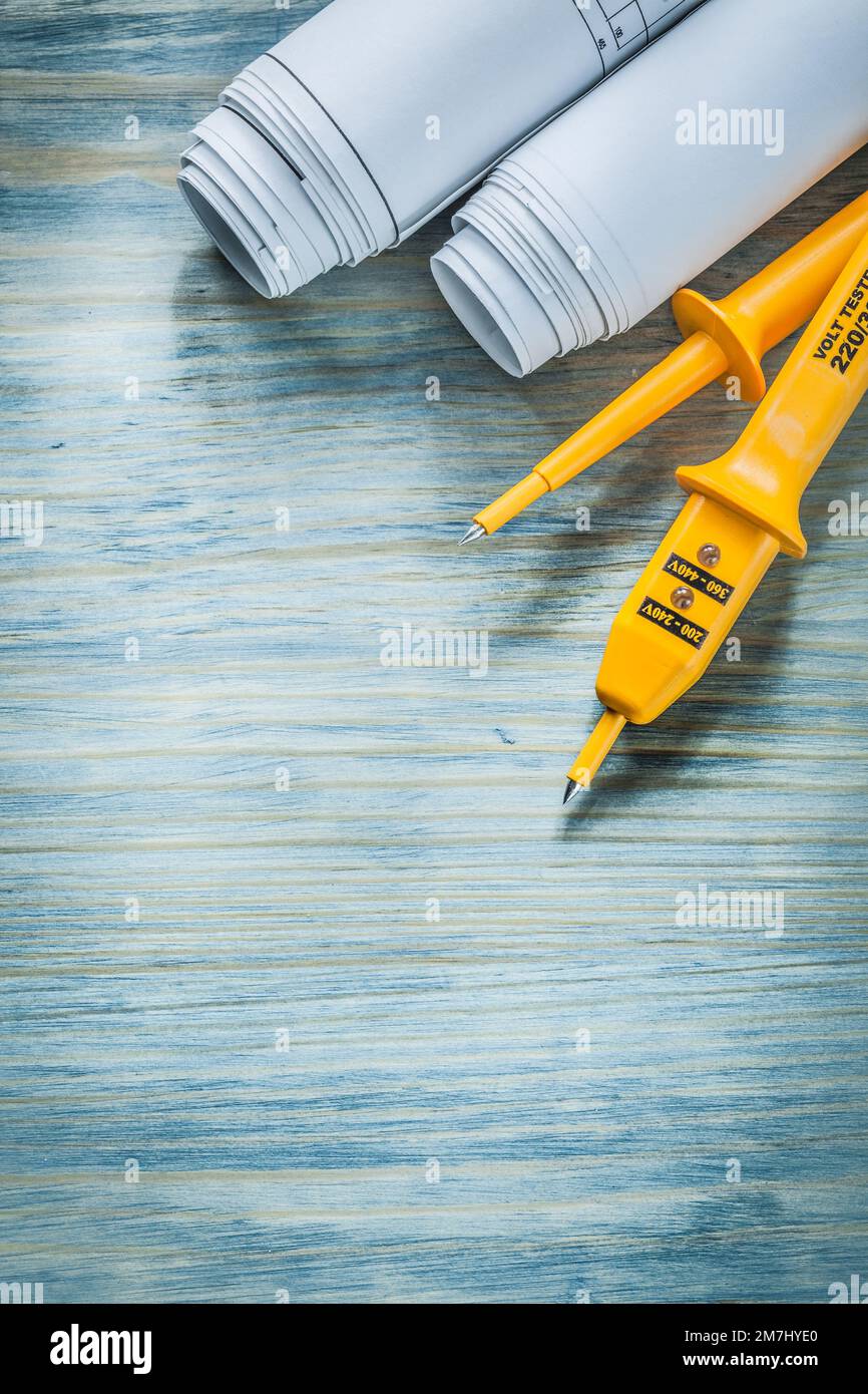 Electric tester construction drawings on wooden board electricity ...