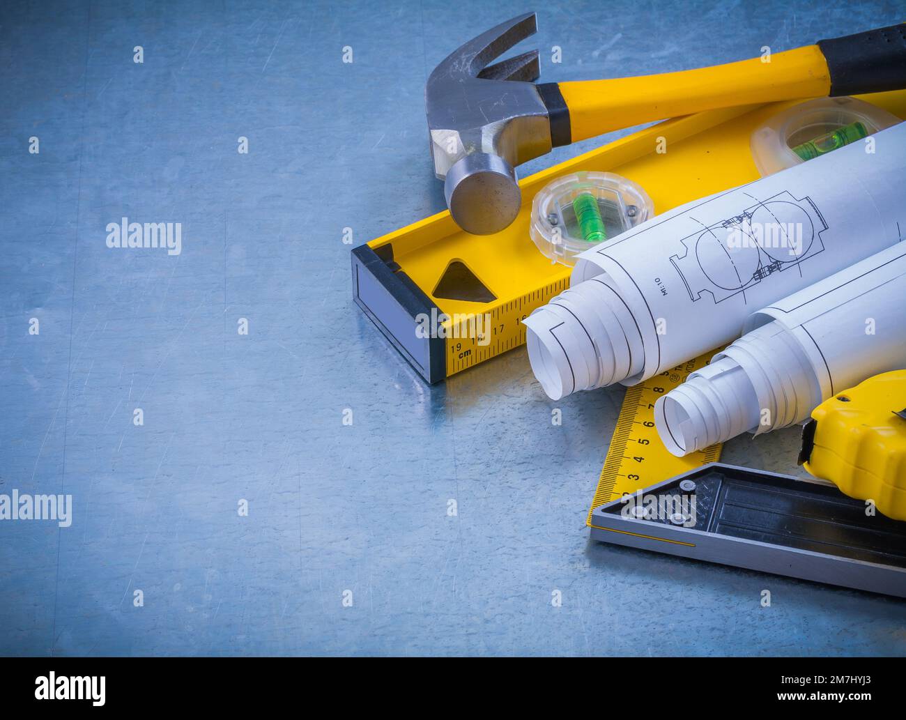 Hammer measuring line construction plans and level square ruler on ...