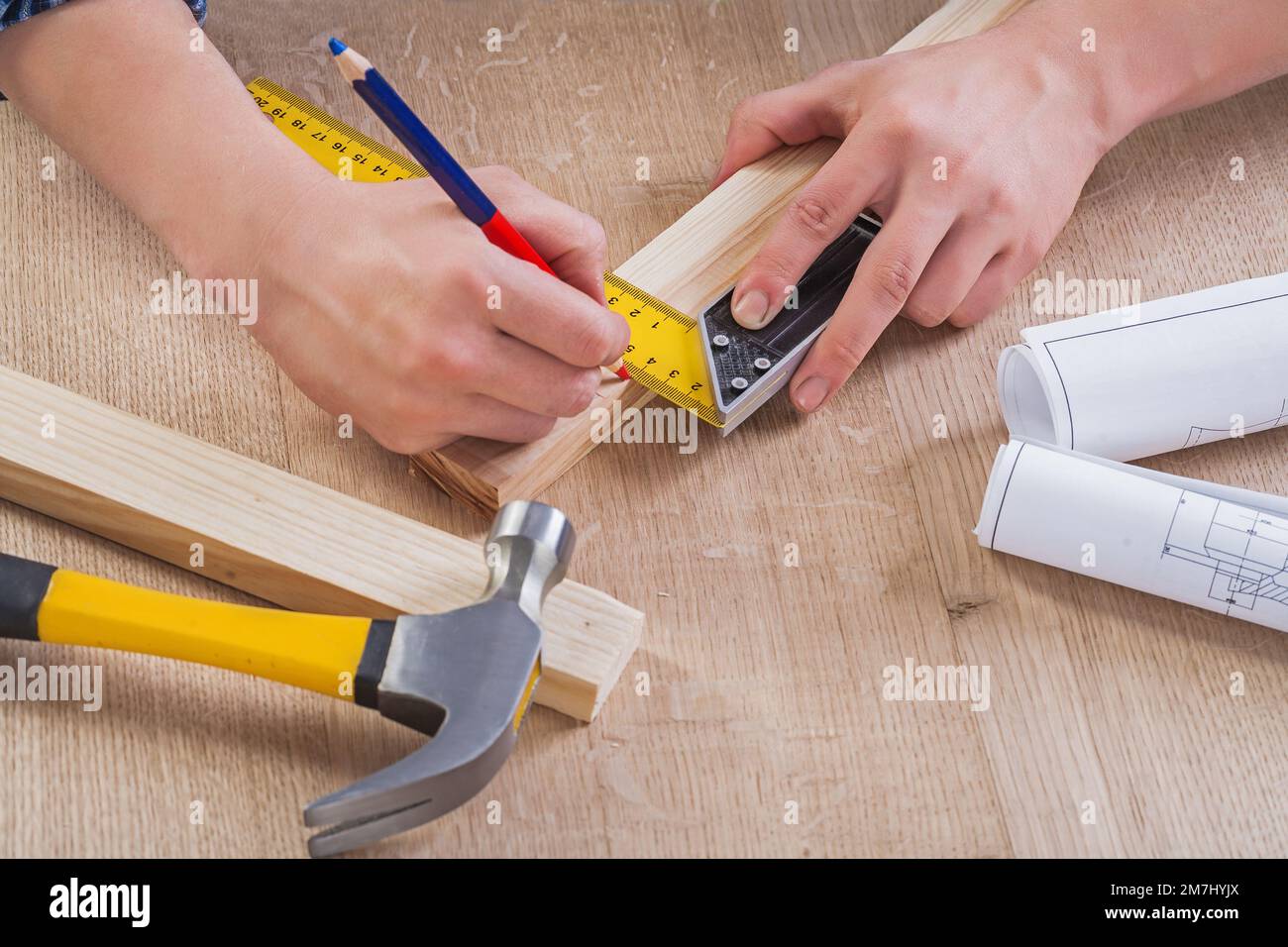 hands of carpenter drawing with pencil wooden plank Stock Photo - Alamy