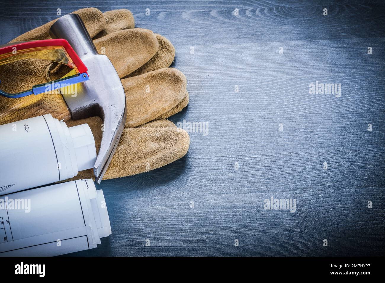 horizontal version rolls of blueprints hammer gloves goggles Stock ...