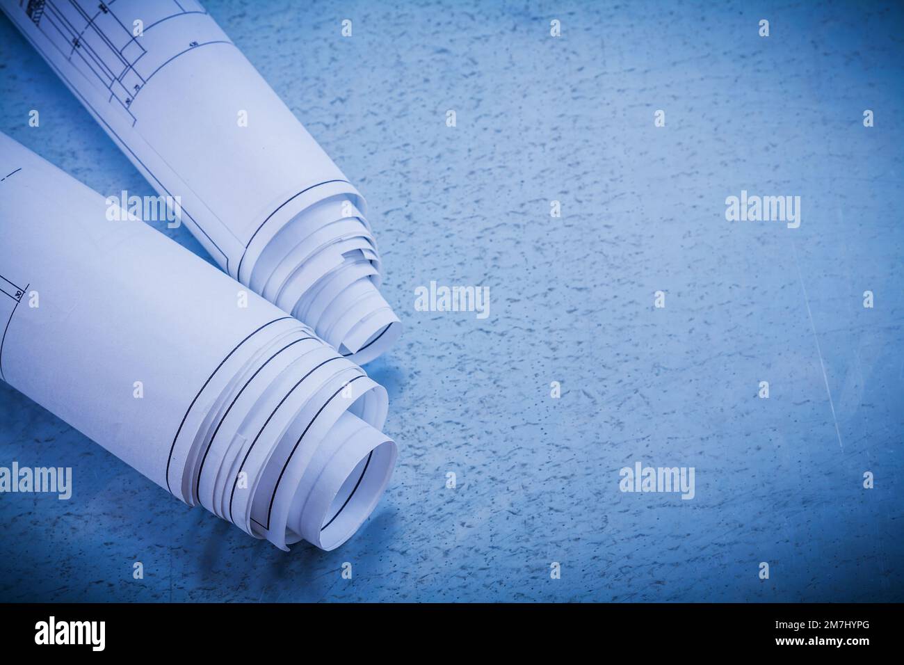 Horizontal view of construction drawings on metallic background ...