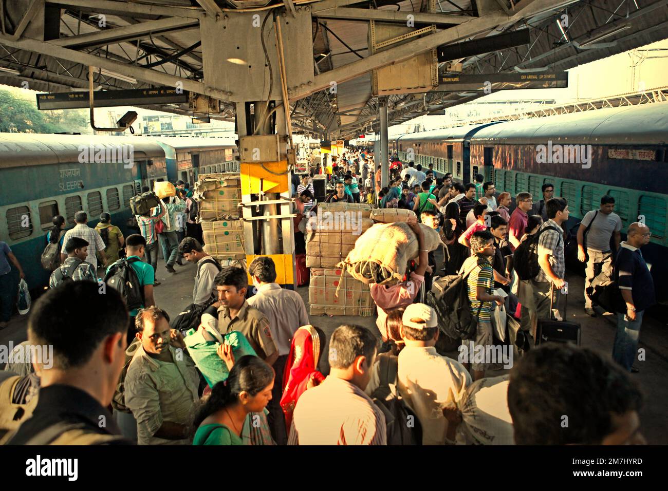 Crowd of train passengers at the passenger platform of New Delhi ...