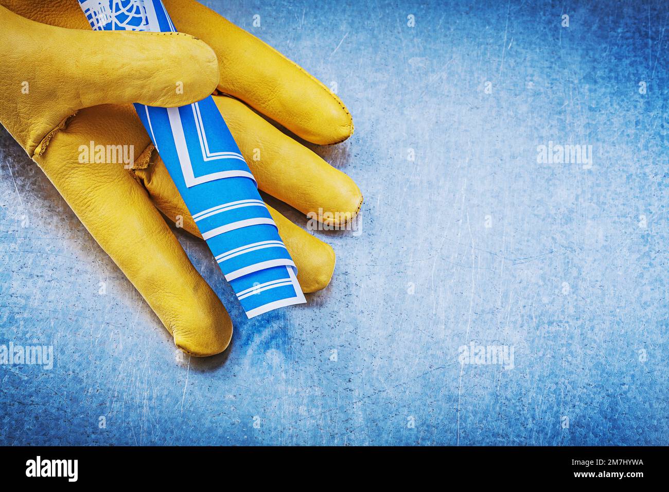 Leather protective gloves blue engineering drawings on metallic ...