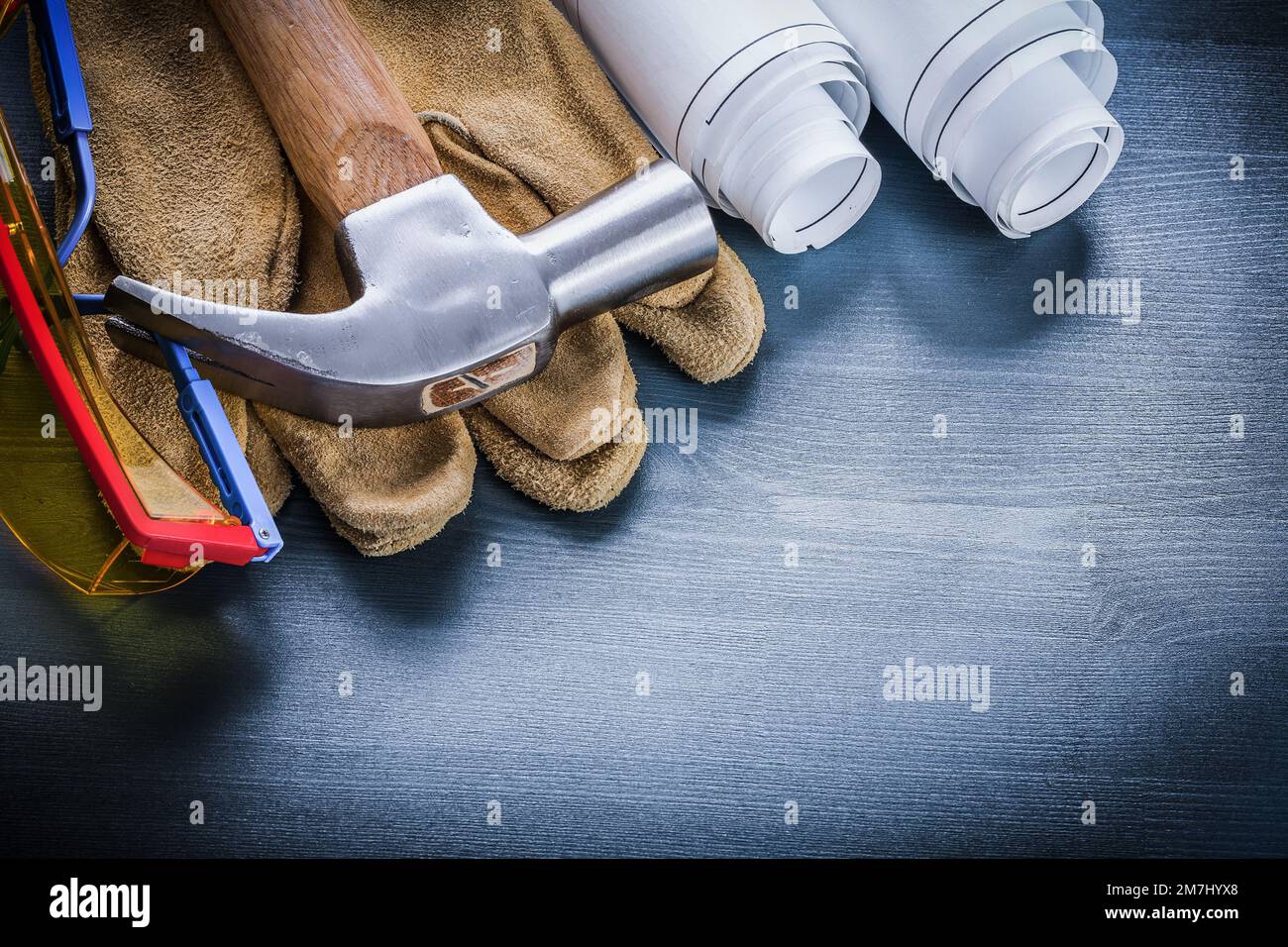 horizontal view working gloves goggles hammer rolled blueprints Stock ...