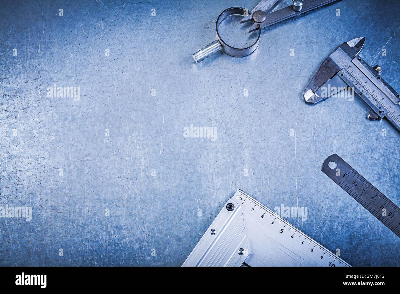 Metal construction drawing compass ruler vernier caliper try square on ...