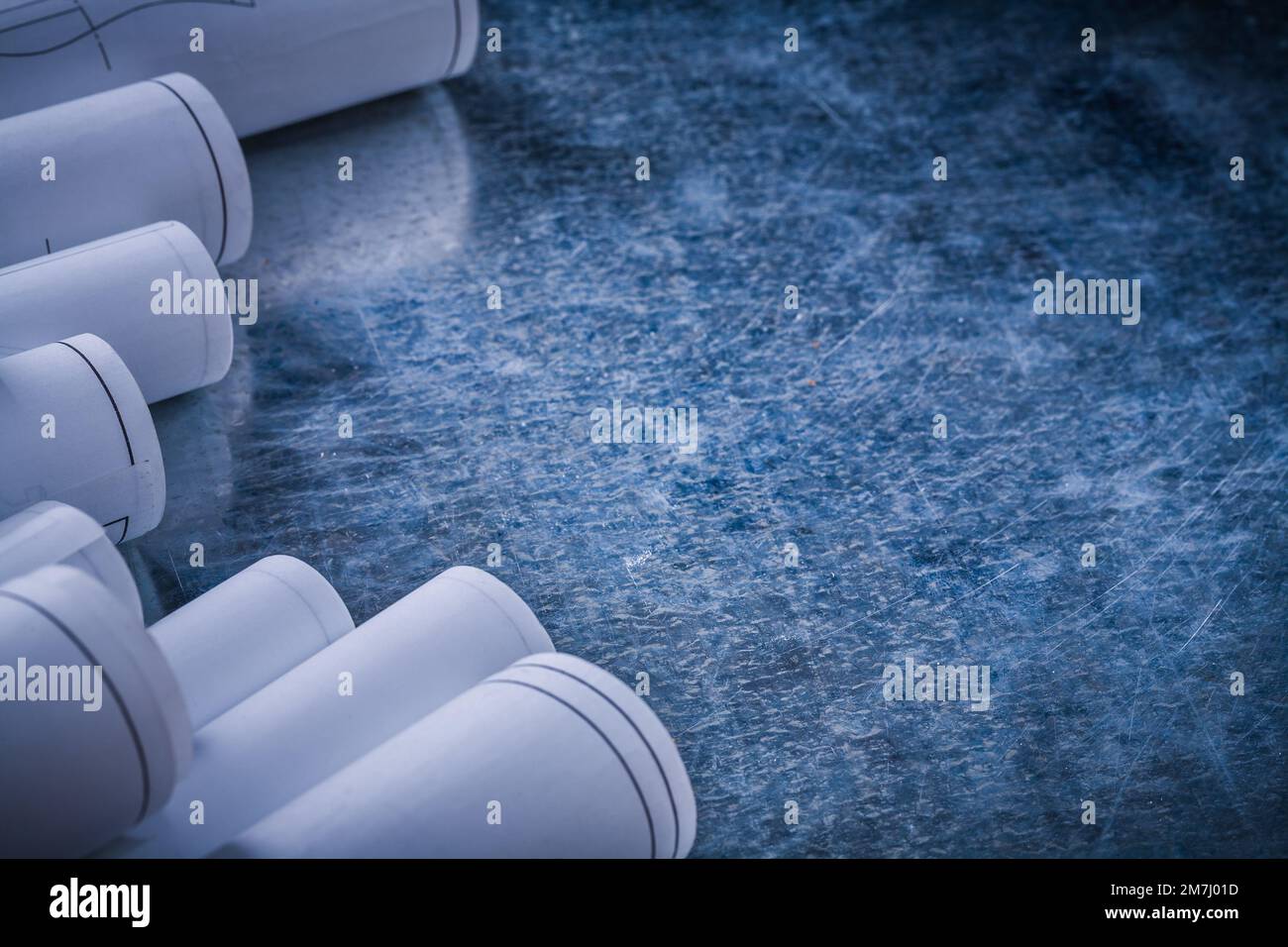 Metallic scratched surface with set of construction drawings copy space ...