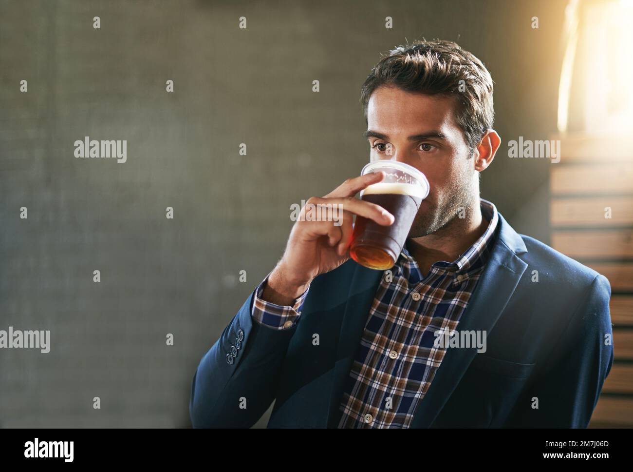 Theres nothing better than a beer after a long day. a man enjoying an ...
