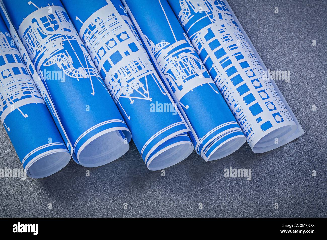 Pile of blue engineering drawings on grey background construction ...