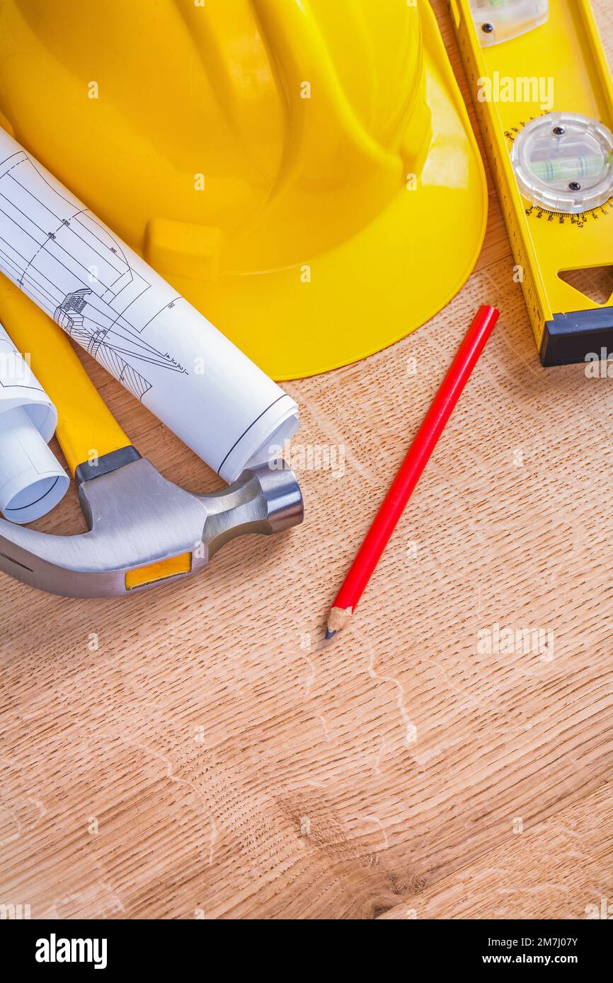 pencil helmet hammer blueprints level on wooden boards Stock Photo - Alamy