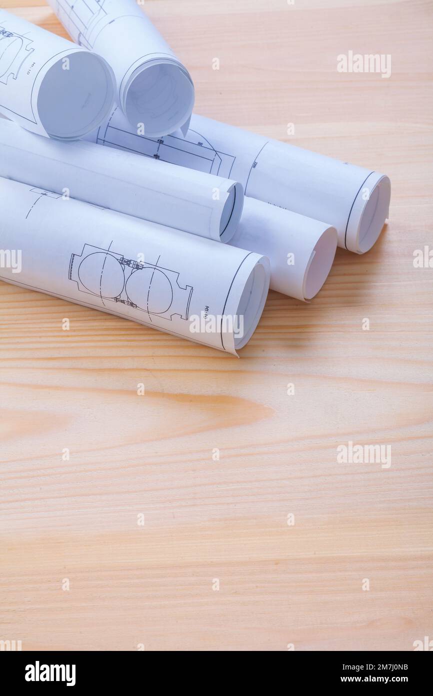 rolled blueprints on wooden boards Stock Photo - Alamy