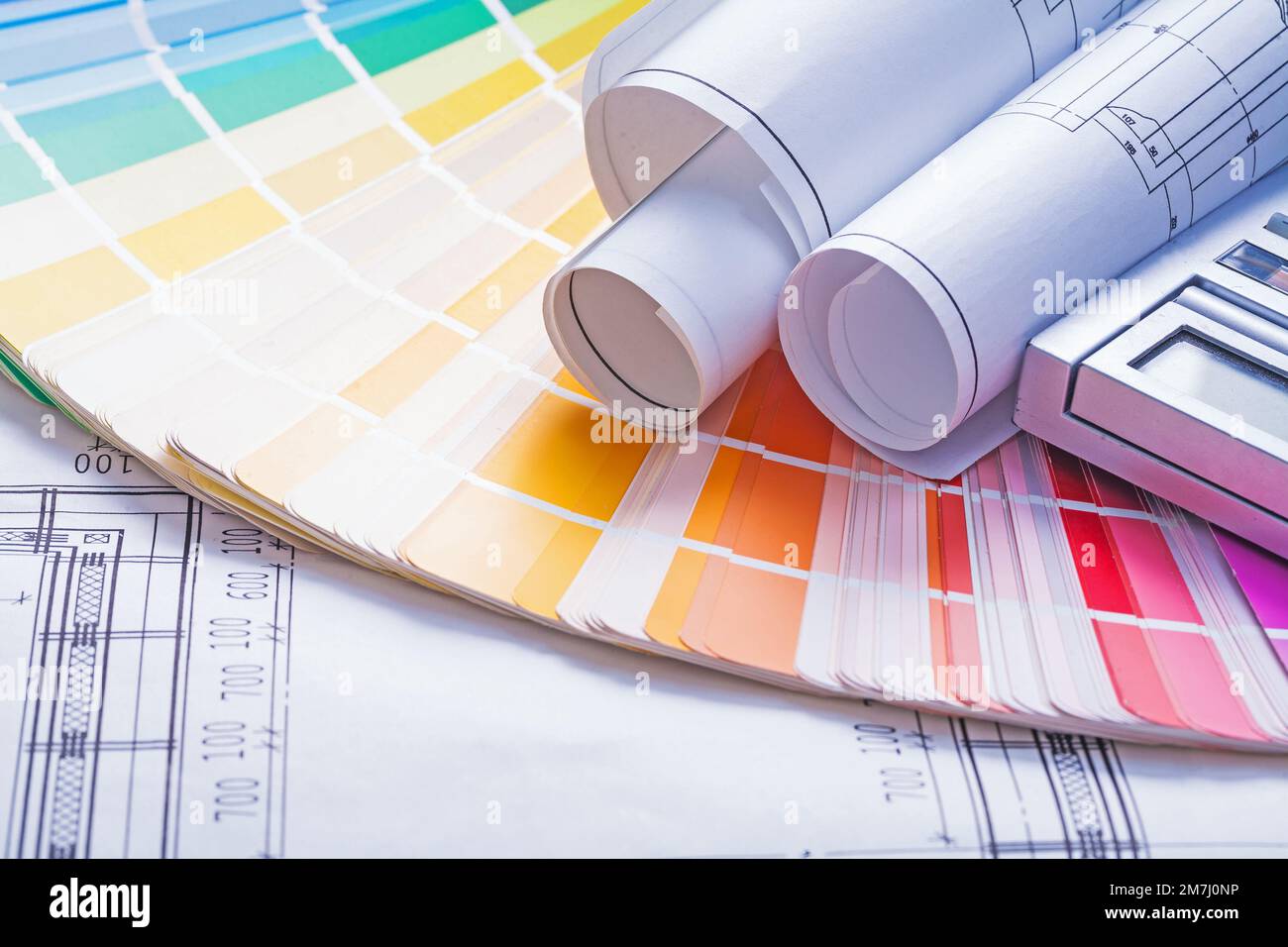 rolled blueprints on color palette Stock Photo - Alamy