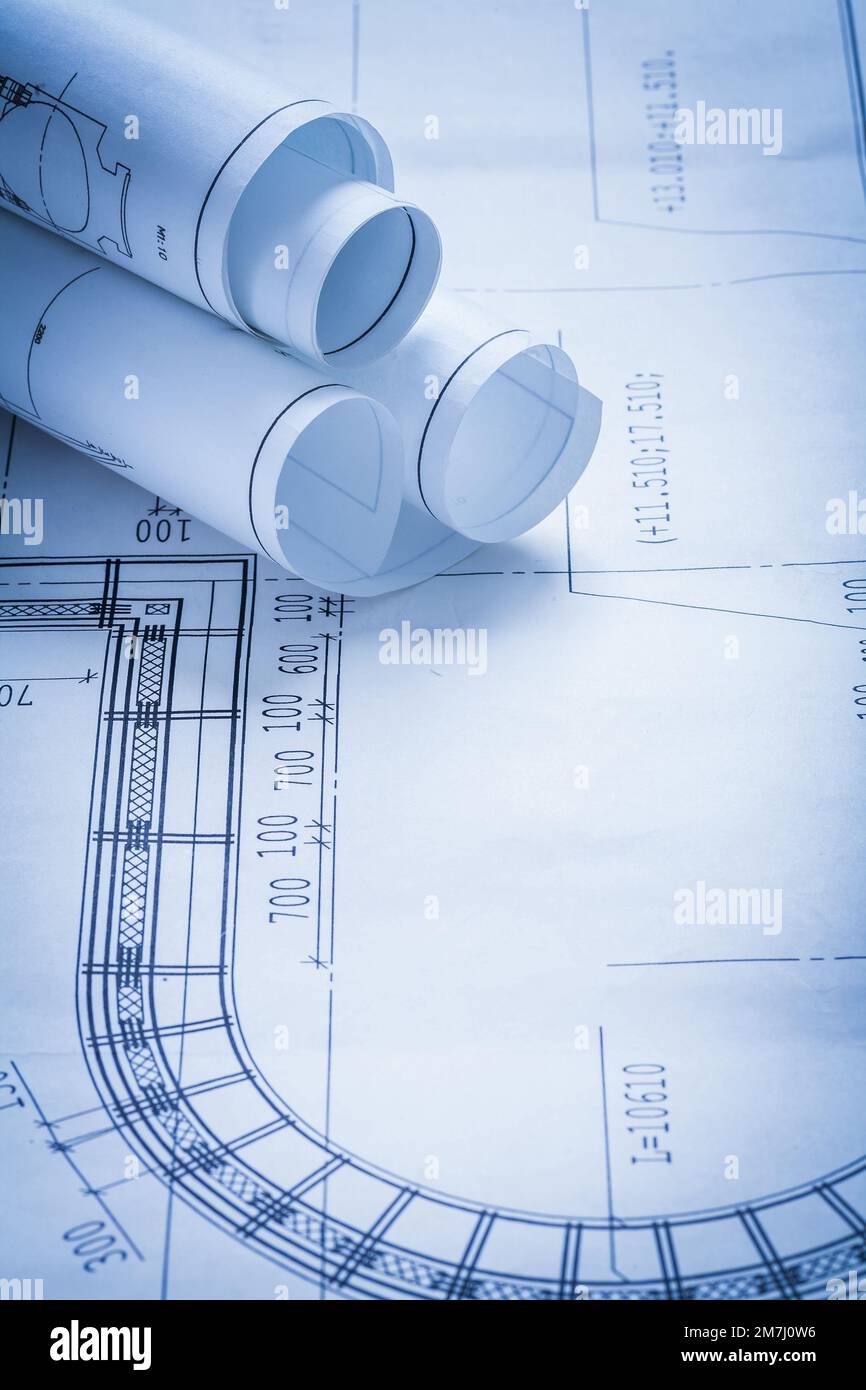 Rolled up construction drawings building and architecture concept Stock ...