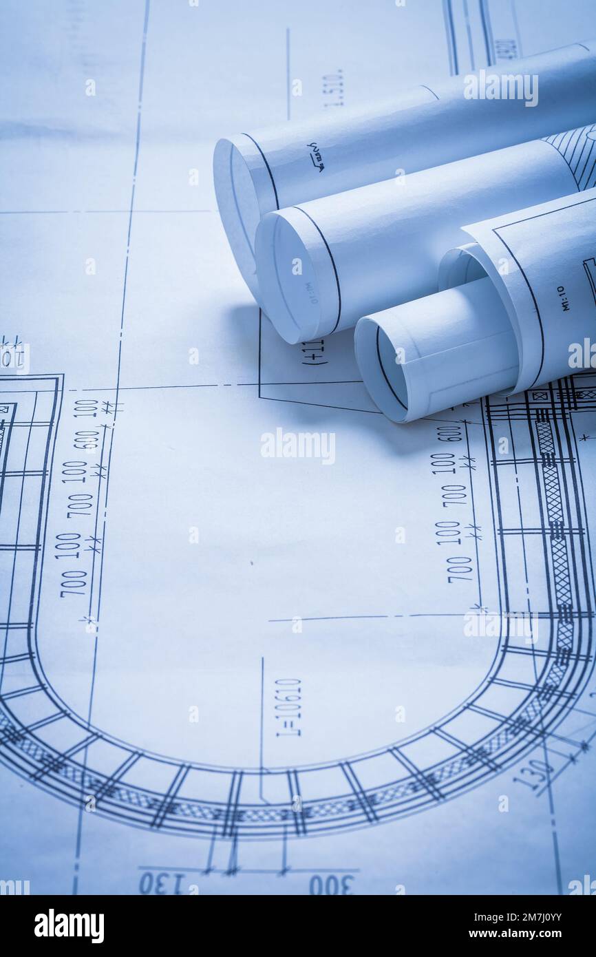 Rolled up construction plans building and architecture concept Stock ...
