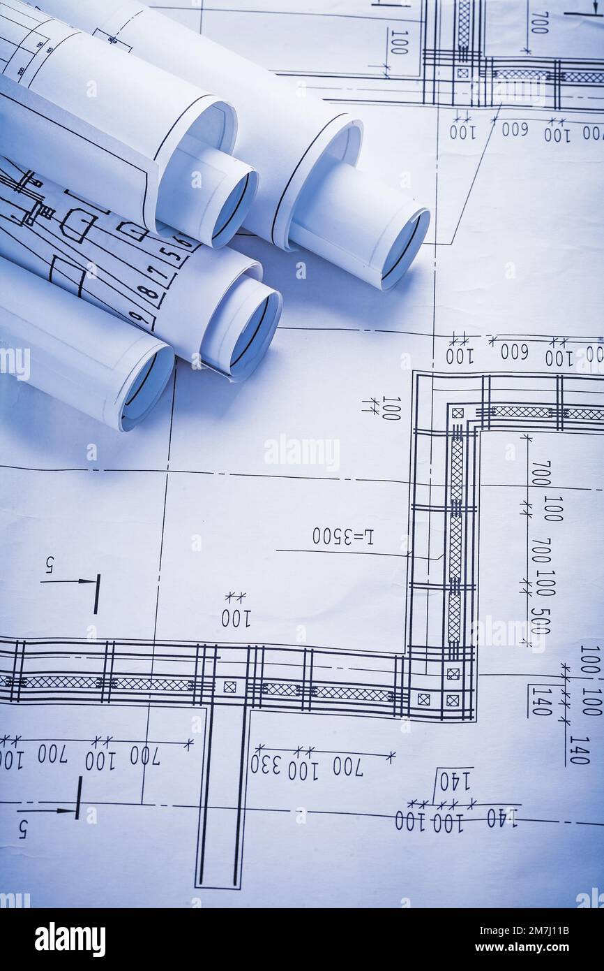 rolls of blueprints with organized copyspace Stock Photo - Alamy