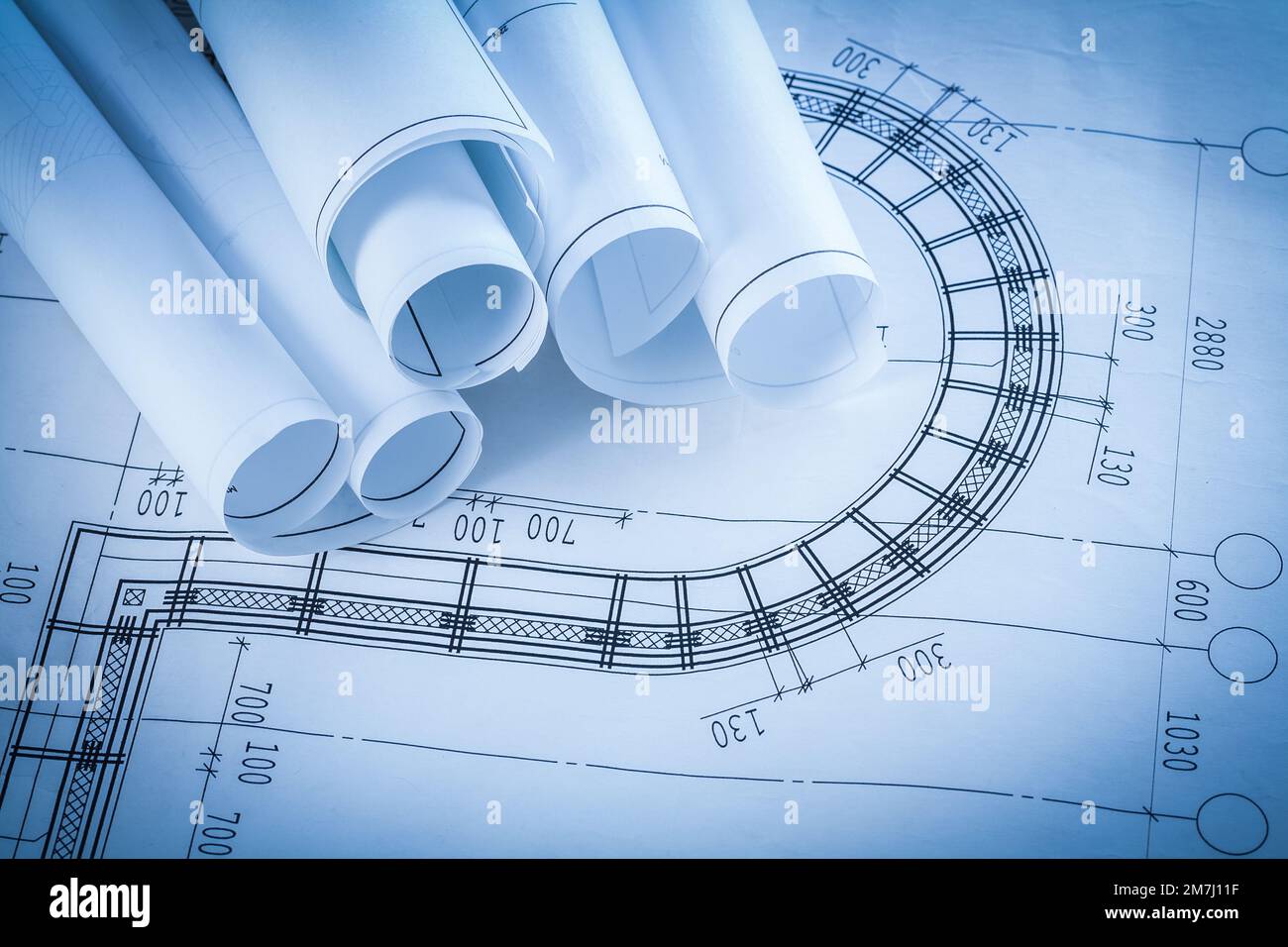 Rolls of construction blueprints building and architecture concept ...