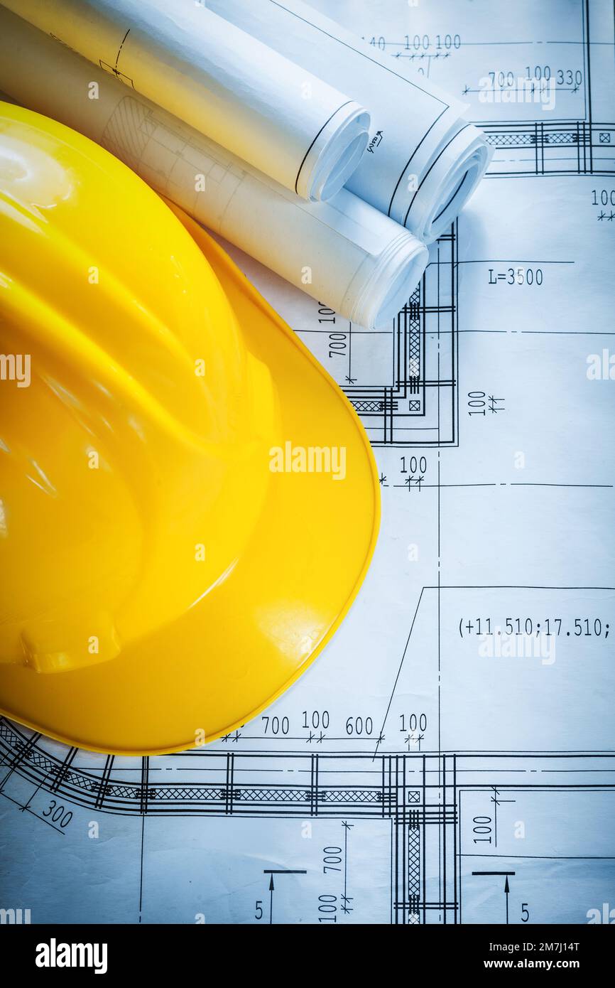 Safety building helmet construction drawings on blueprint Stock Photo ...