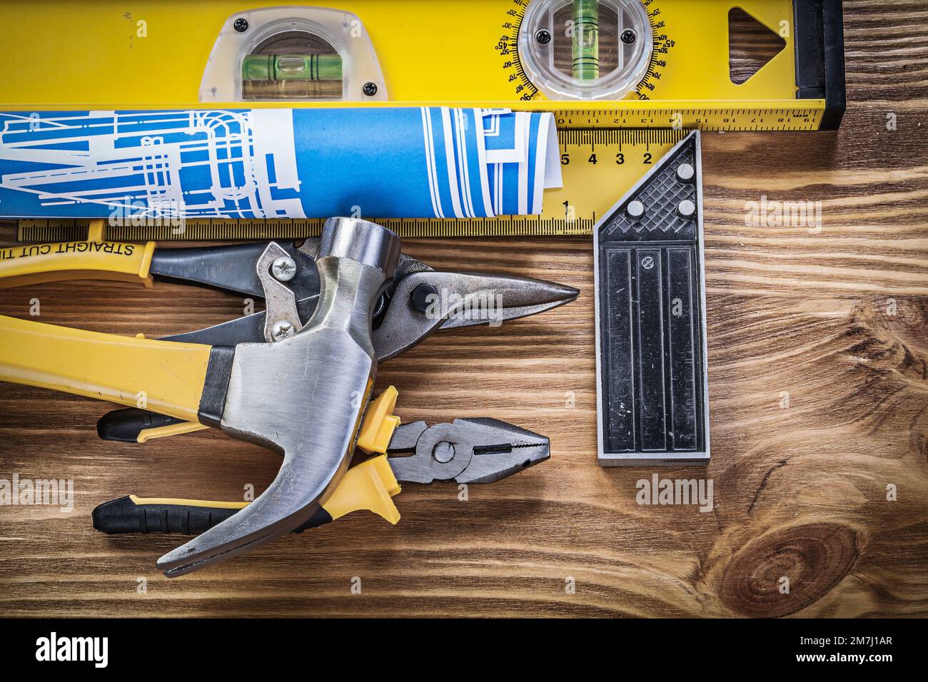 Set of construction tools on wooden board top view Stock Photo - Alamy