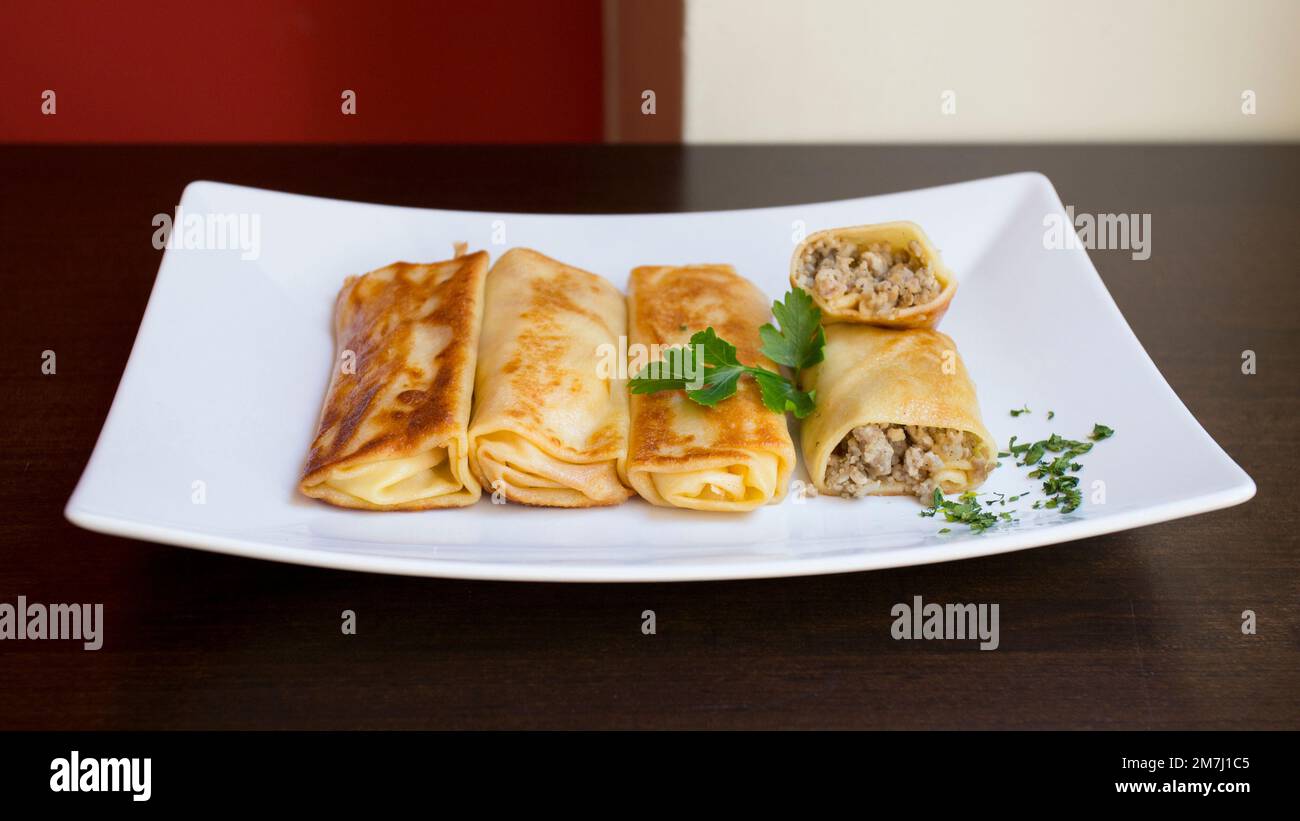A blini, or sometimes blin, is a Russian and more broadly Eastern ...