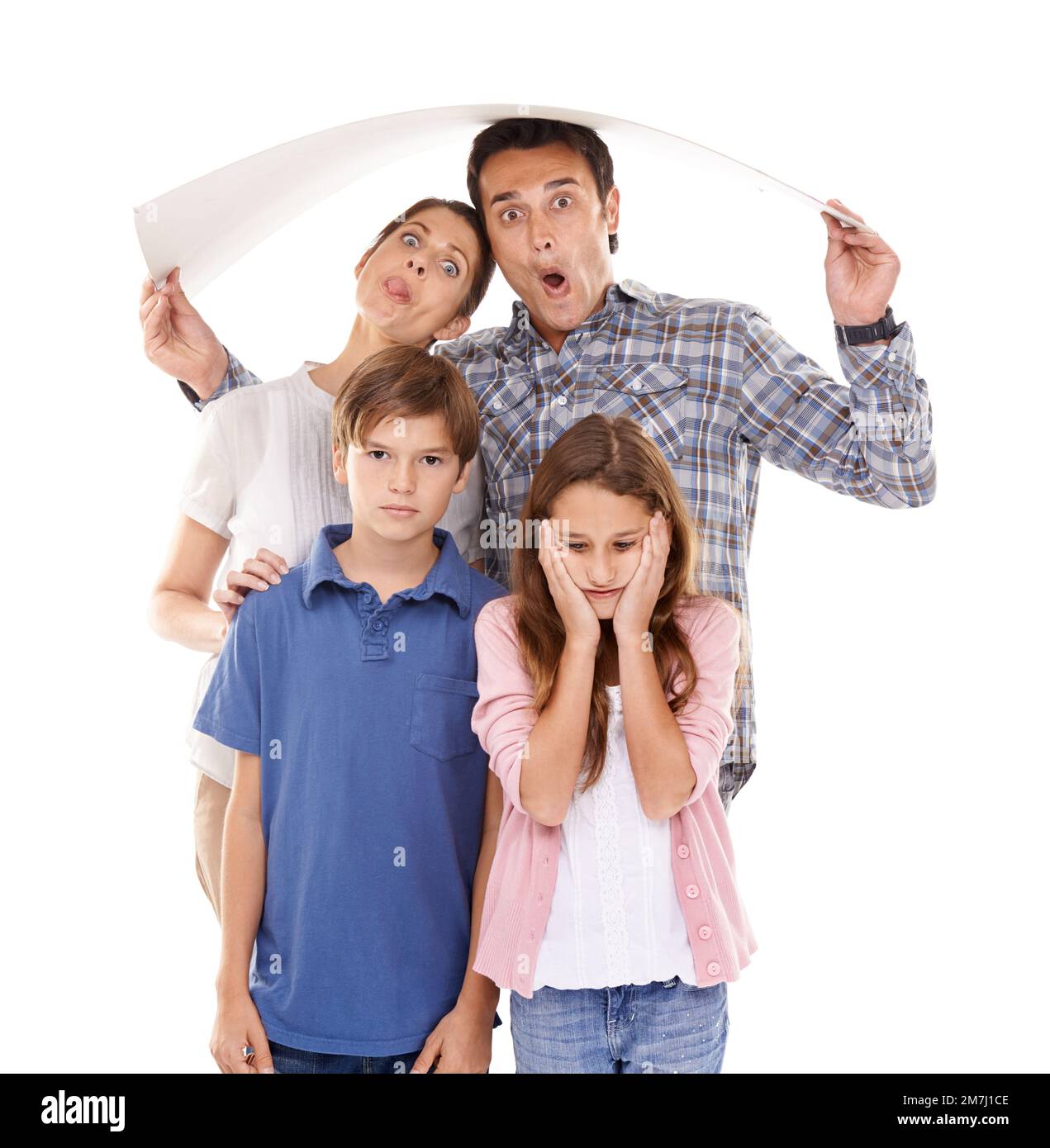 Mom..Dad..stop, youre embarrassing us. Studio shotwo children looking embarrassed by their ...