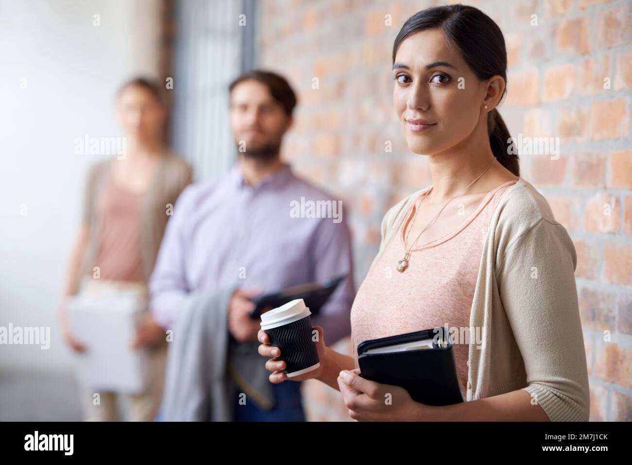 The number one team in the business. three young colleagues in their ...