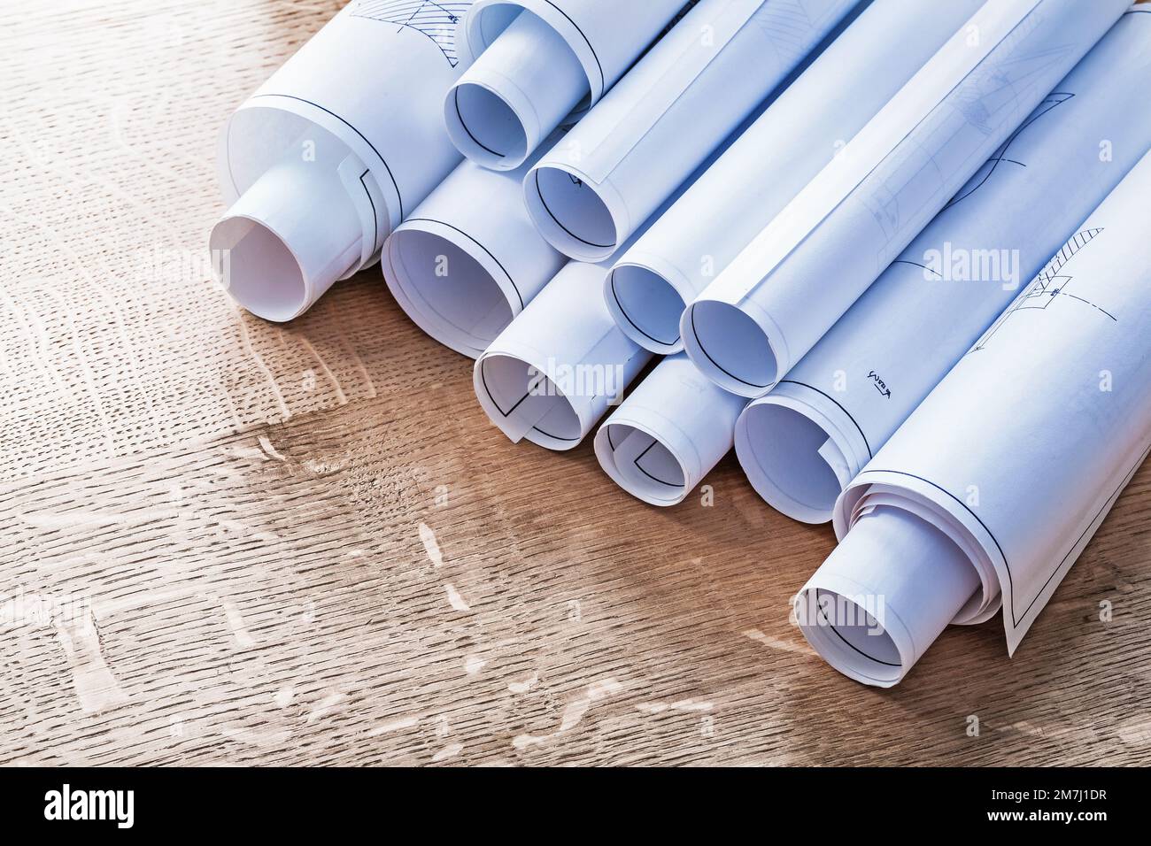 Stack of blueprint rolls on wood oaken board construction concept Stock ...