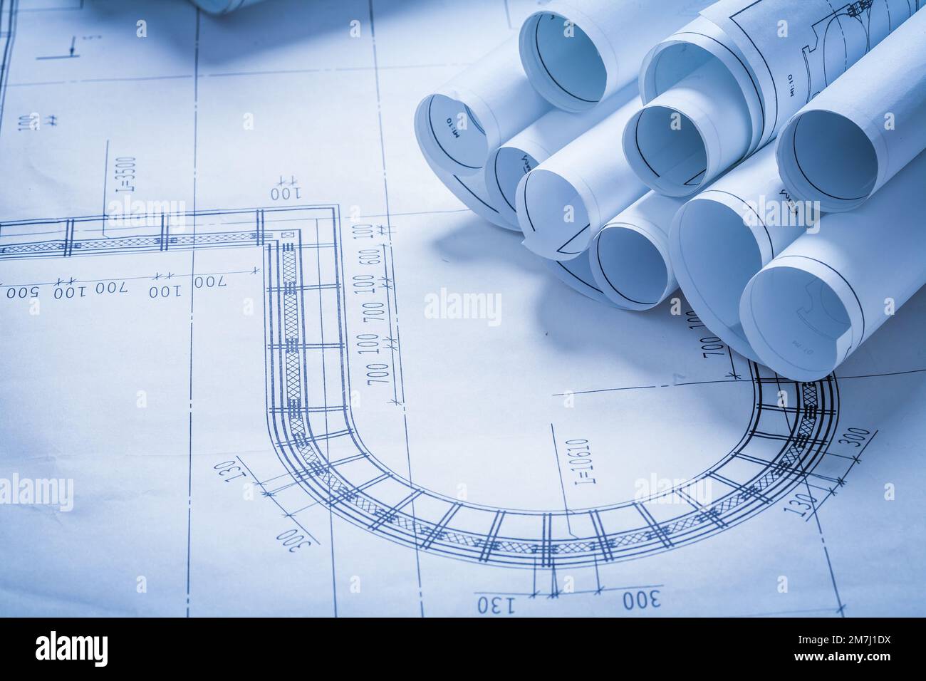 Stack of blueprint rolls construction concept Stock Photo - Alamy