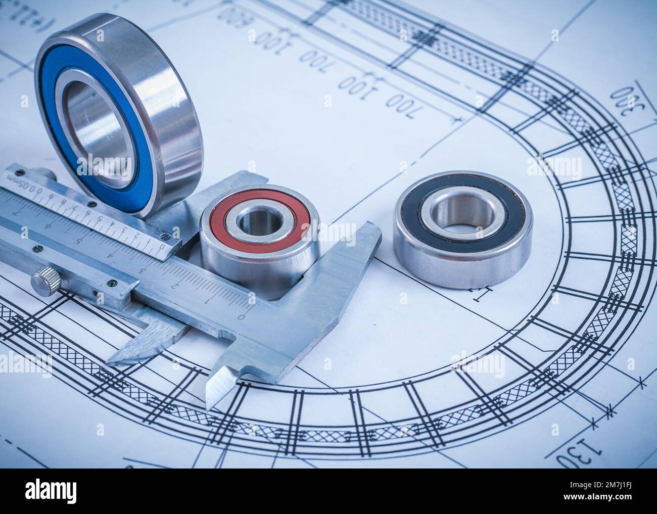 Stainless rolling bearings and slide caliper on blueprint construction ...