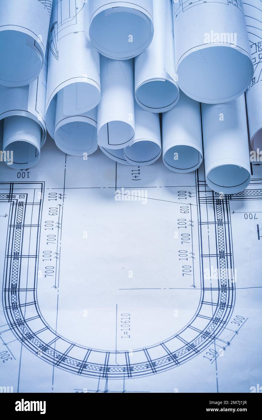 Variety of blueprint rolls construction concept Stock Photo - Alamy