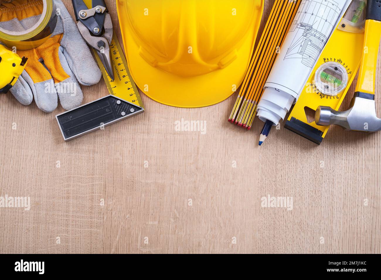 Variety of building objects on oak wooden board construction concept ...