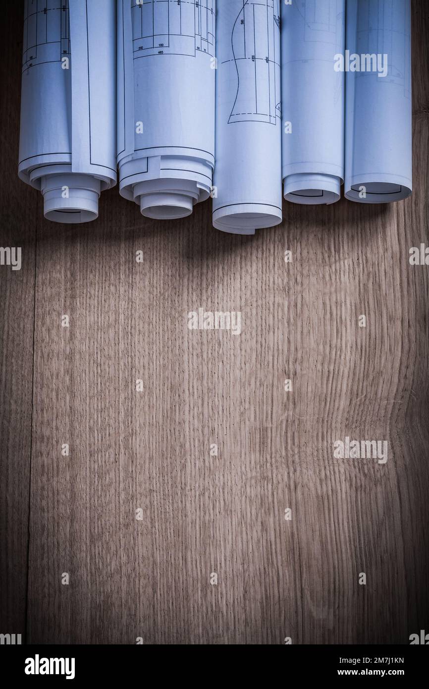 Vertical image of construction drawings on wooden board Stock Photo - Alamy