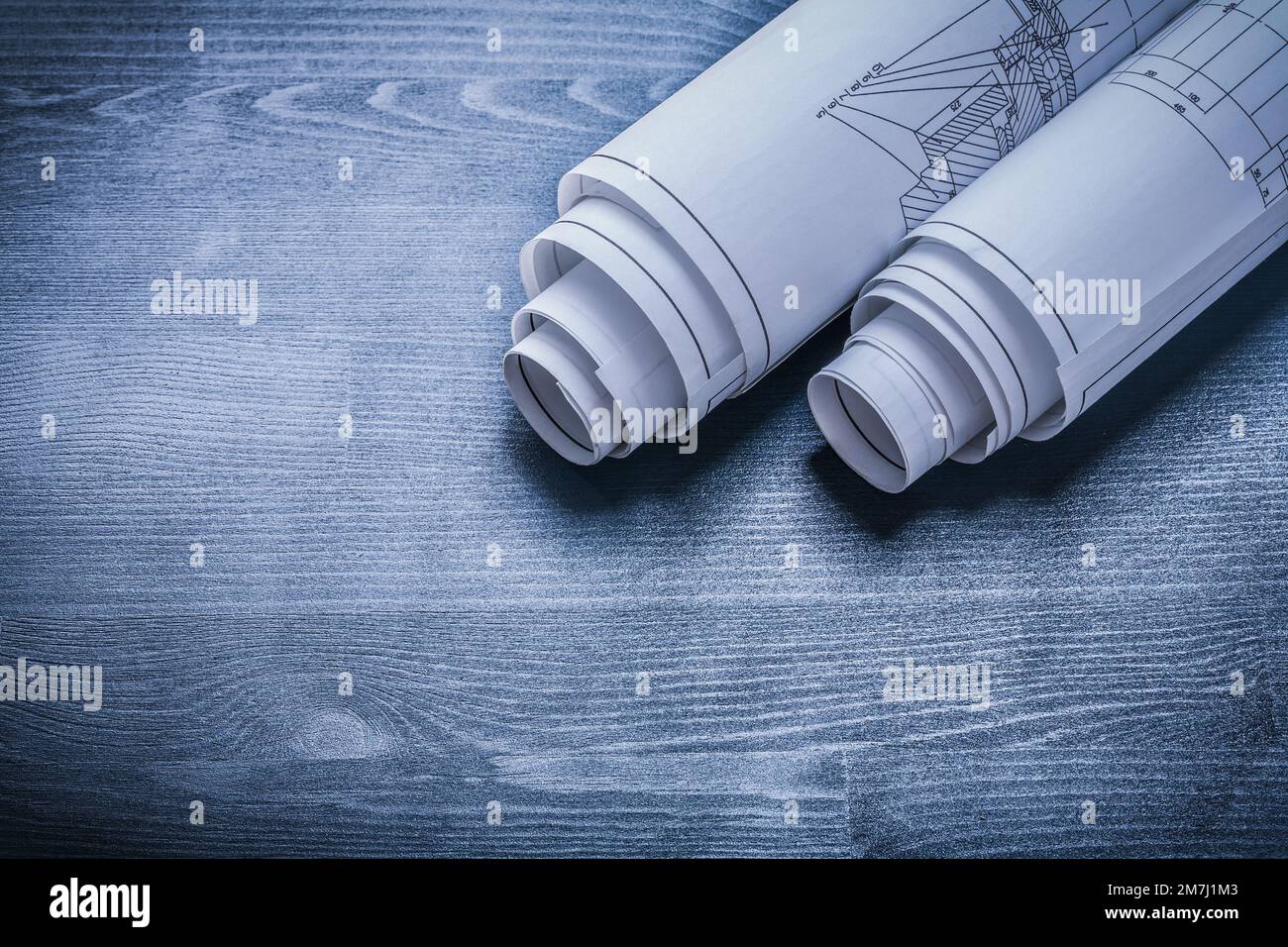 two rolled white blueprints Stock Photo - Alamy