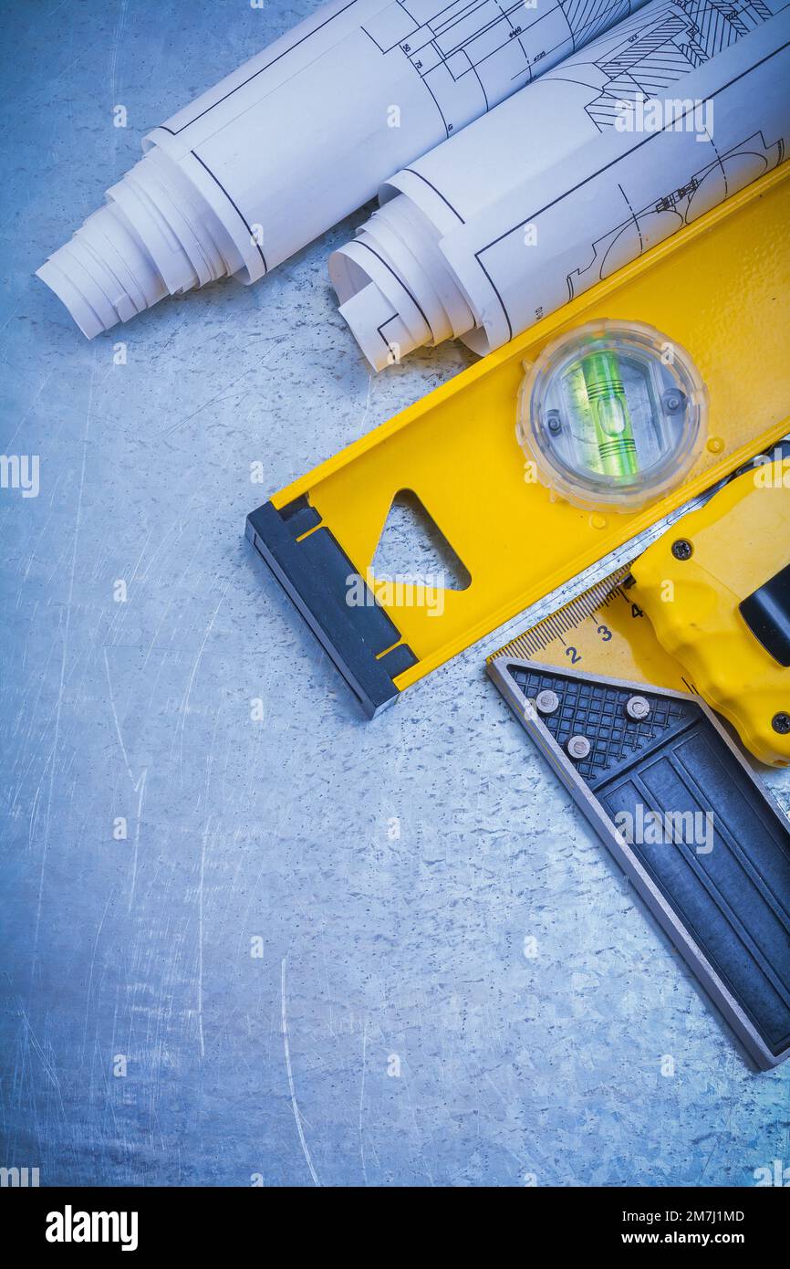 Vertical version of construction plans and level tape measure square ...