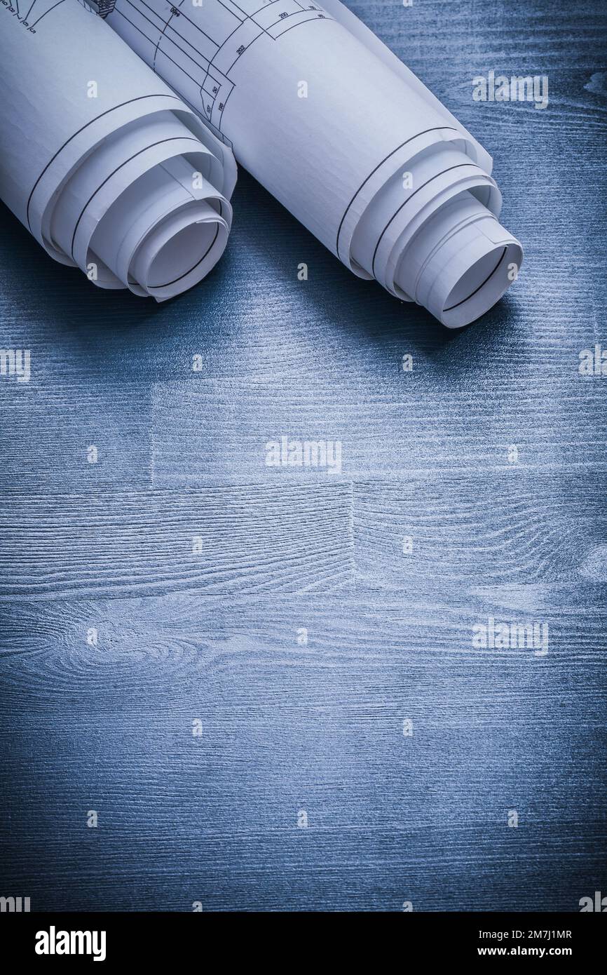 vertical view copyspace image white rolled blueprints Stock Photo - Alamy