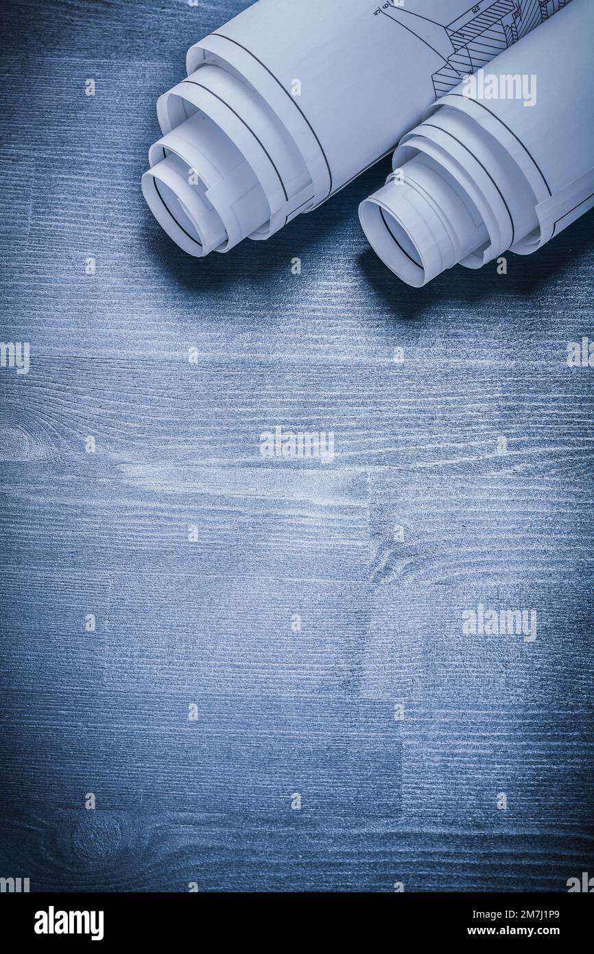 vertical view two rolled white blueprints Stock Photo - Alamy